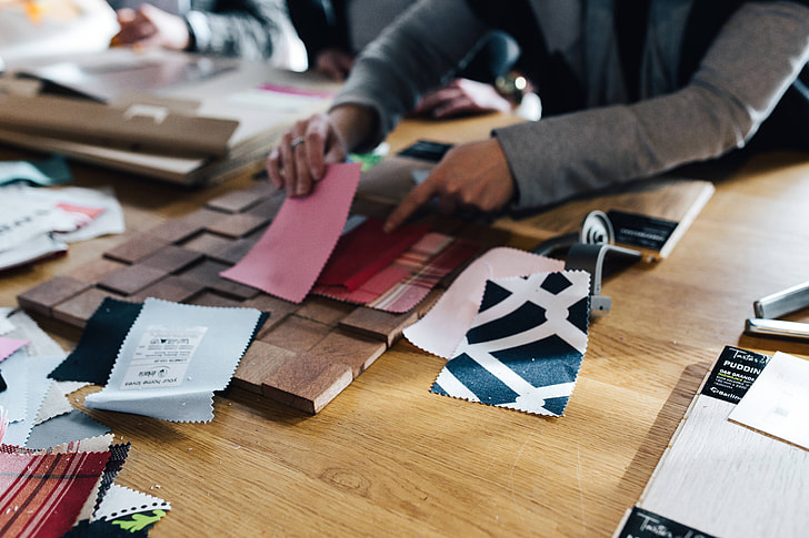 Designers working with material samples and paper cutouts | free photos ... Designers working with material samples and paper cutouts | free photos ...